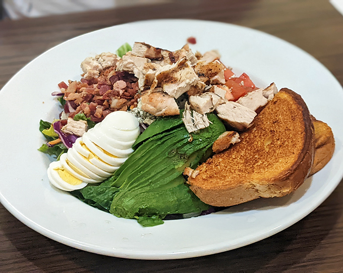 This Cobb salad isn't just lunch – it's a colorful masterpiece of fresh ingredients that makes eating healthy feel like cheating.
