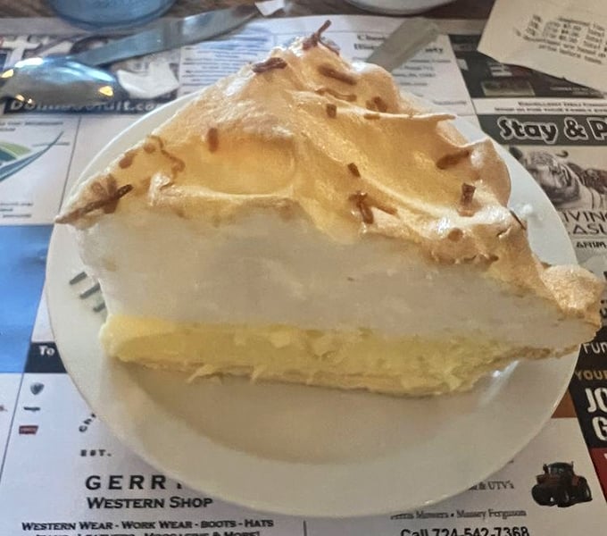 Coconut cream pie that would make your grandmother both proud and jealous—cloud-like meringue floating above creamy paradise.