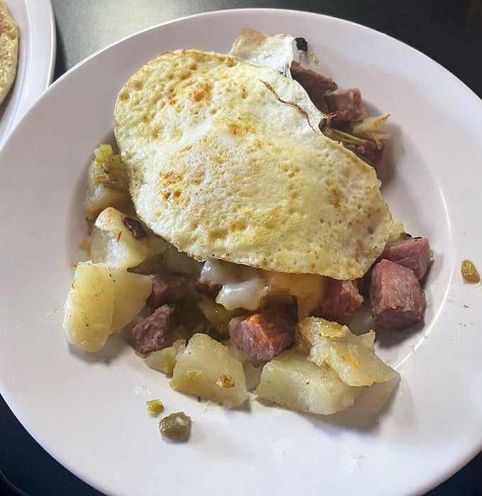This isn't just corned beef hash; it's a hearty mountain of breakfast bliss topped with an egg cooked exactly how the breakfast gods intended.