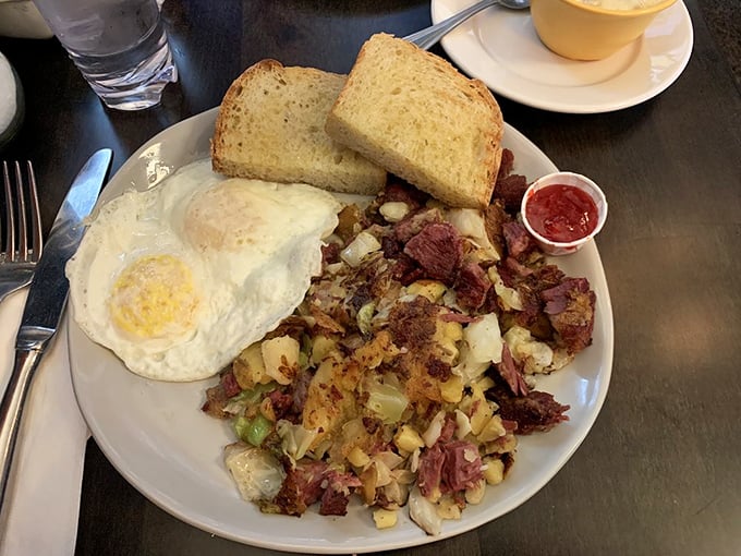 Corned beef hash that would make your Irish grandmother weep with joy. Crispy edges, tender meat, and that perfectly runny egg—breakfast doesn't get more perfect.