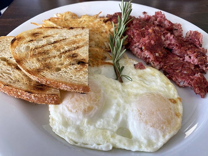 Corned beef hash with perfectly fried eggs – the breakfast that says "today might be tough, but at least it started right."
