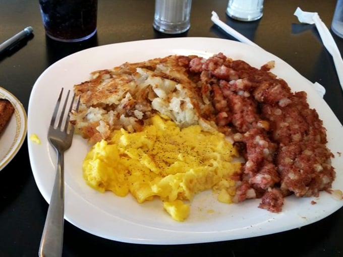 Corned beef hash, eggs, and potatoes—the holy trinity of breakfast that's been solving life's problems since diners were invented.