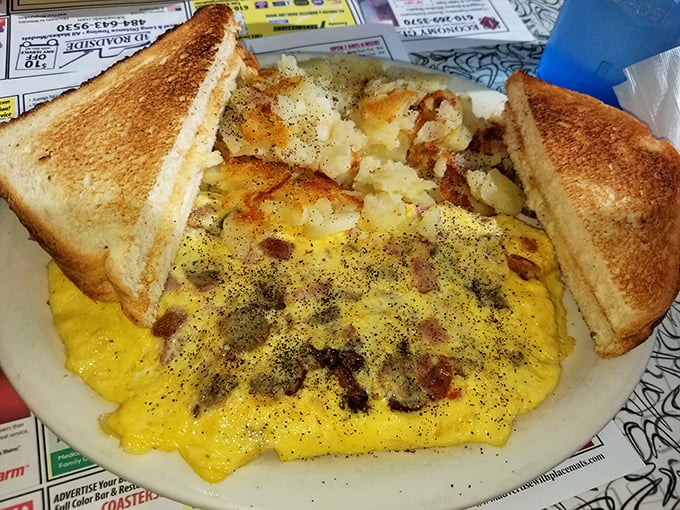 The breakfast trifecta: perfectly scrambled eggs, home fries with just the right amount of crust, and toast ready for its butter baptism.
