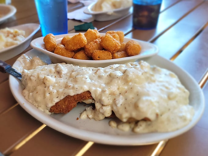 Country fried steak swimming in gravy—comfort food so good it should come with a warning: "May induce spontaneous sighs of contentment."