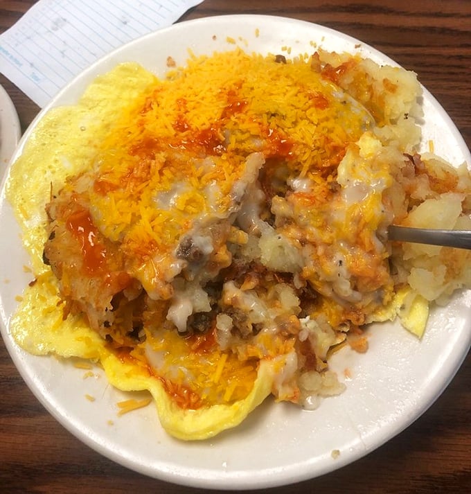Behold the country skillet—where potatoes, cheese, and eggs unite in a harmony so perfect it deserves its own national anthem.