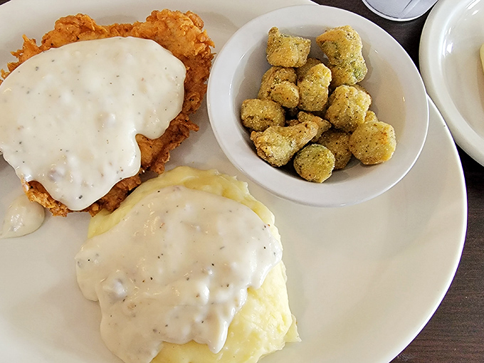 Country fried steak and gravy – where crispy exterior meets tender interior in a dance as old as the South itself.