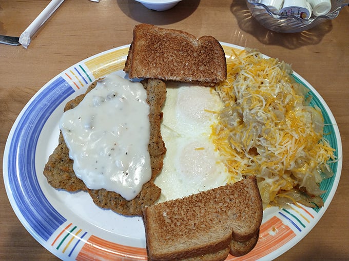 Country fried steak with gravy, eggs, and cheese-laden hash browns—the breakfast equivalent of hitting the comfort food jackpot.