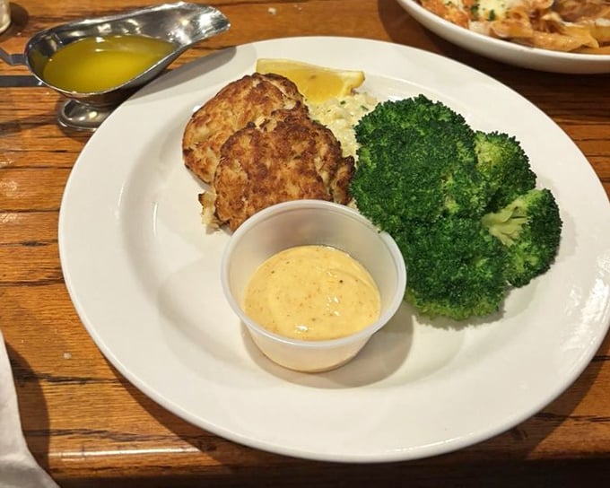 Golden-brown crab cakes that could make Maryland jealous, served with a side of broccoli that actually deserves to share the plate.