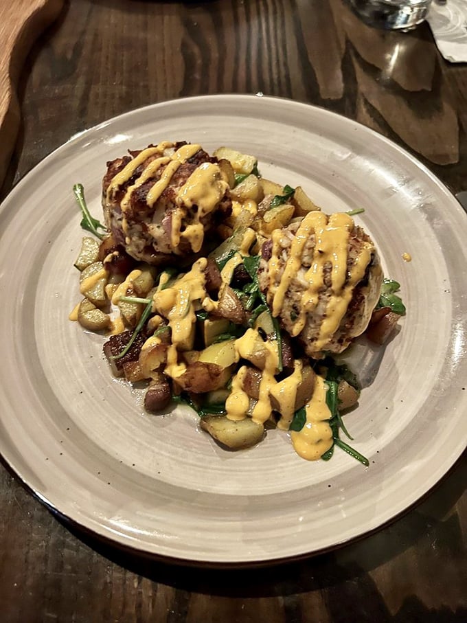 These crab cakes aren't just browned – they're caramelized to perfection, with a sauce drizzle that should have its own Instagram account.
