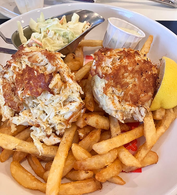 These golden-brown crab cakes are what dreams are made of—mostly crab, minimal filler. Served atop hand-cut fries, they're the definition of simple perfection.