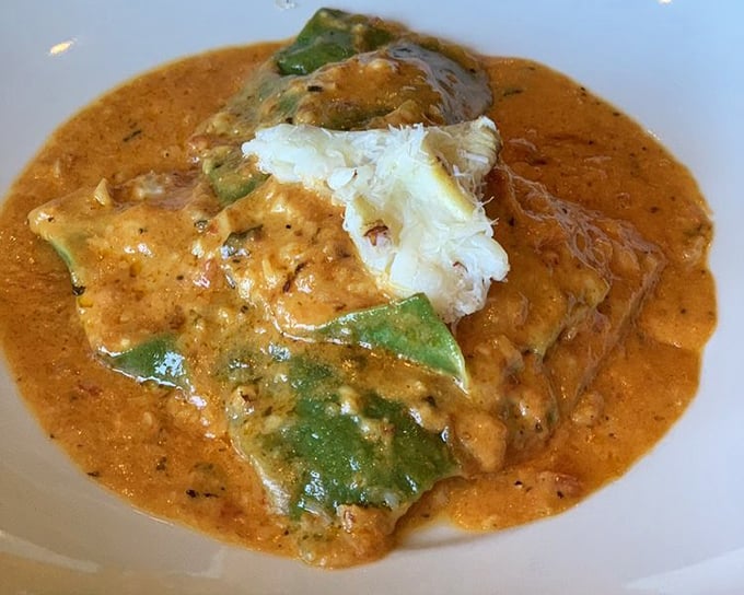 This crab ravioli swims in a sauce so rich and velvety, you'll want to request a straw for backup when your bread runs out.