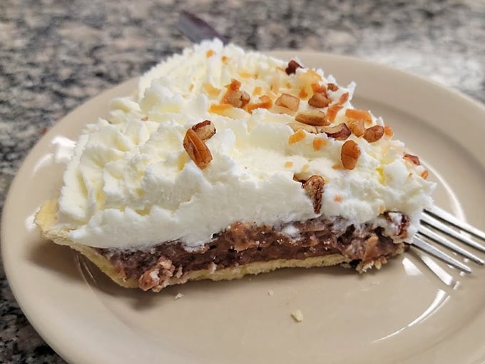 That chocolate cream pie with its cloud of whipped topping and pecan garnish isn't just dessert—it's an event.
