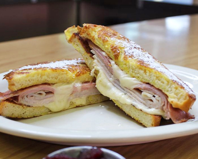 The Monte Cristo sandwich: where French toast meets ham and cheese in a relationship so perfect it should have its own romantic comedy.