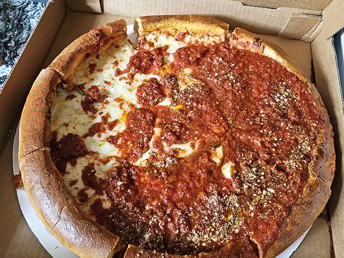 Deep dish dreams come true in this glorious construction of crust, sauce, and cheese. Not just a pizza – it's an architectural achievement.