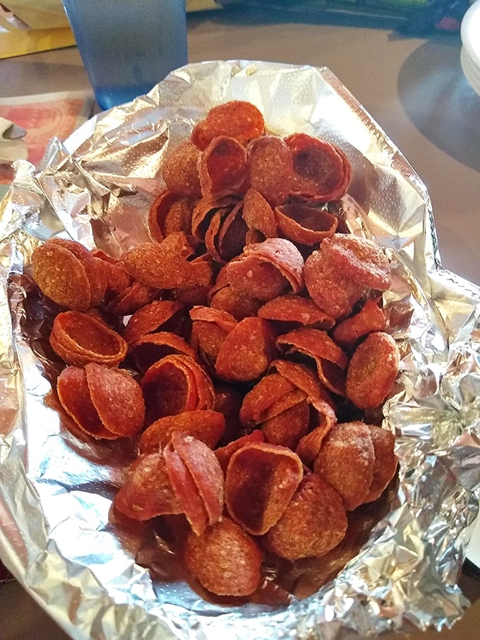 Fried pepperoni: the snack you never knew you needed until now. Crispy, spicy little discs of joy that make potato chips seem like a sad compromise.