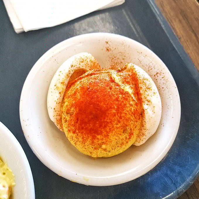 Deviled eggs sprinkled with paprika—a humble classic elevated to art form. Grandmothers everywhere would give their silent nod of approval to these creamy delights.