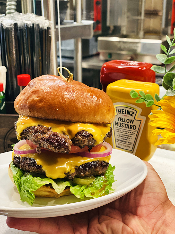 This isn't just a burger; it's a skyscraper of deliciousness. The cheese cascade alone deserves its own Instagram account.