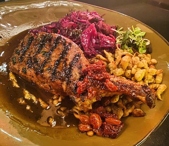 The double-cut pork chop arrives like a meaty island surrounded by colorful companions—proof that "the other white meat" deserves star billing too.