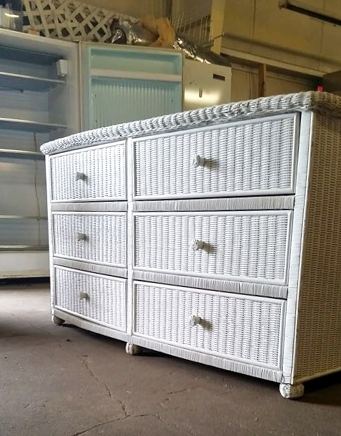 This white wicker dresser isn't just storage—it's coastal charm waiting to brighten a bedroom. Beachside vibes in the heart of lake country.