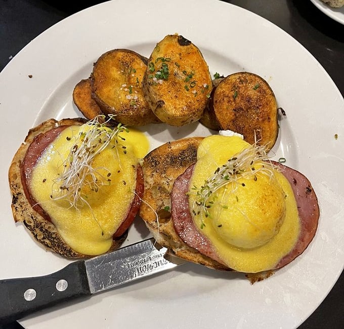 Eggs Benedict – where hollandaise meets Canadian bacon in a morning romance that's lasted longer than most Hollywood marriages. Those home fries are no mere supporting actors.