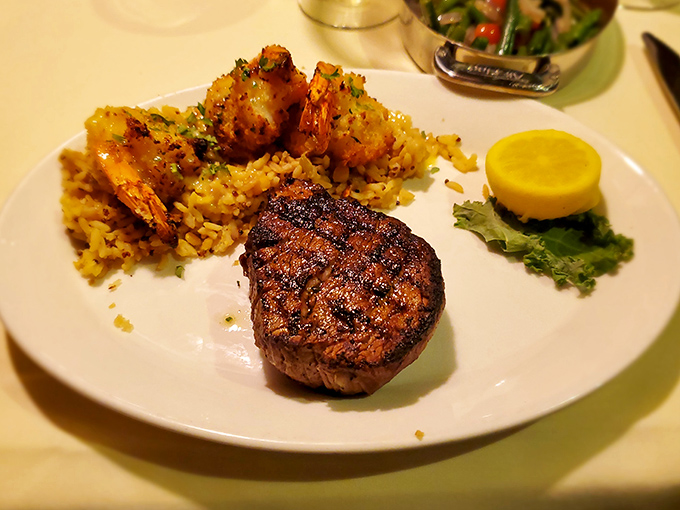 A perfectly cooked filet mignon with jumbo shrimp – proof that "surf and turf" isn't just a meal, it's a philosophy worth living by.