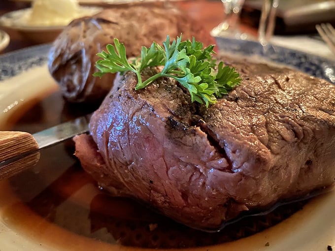 This filet mignon, tender as a love letter, sits in a pool of its own juices like royalty taking a decadent bath.