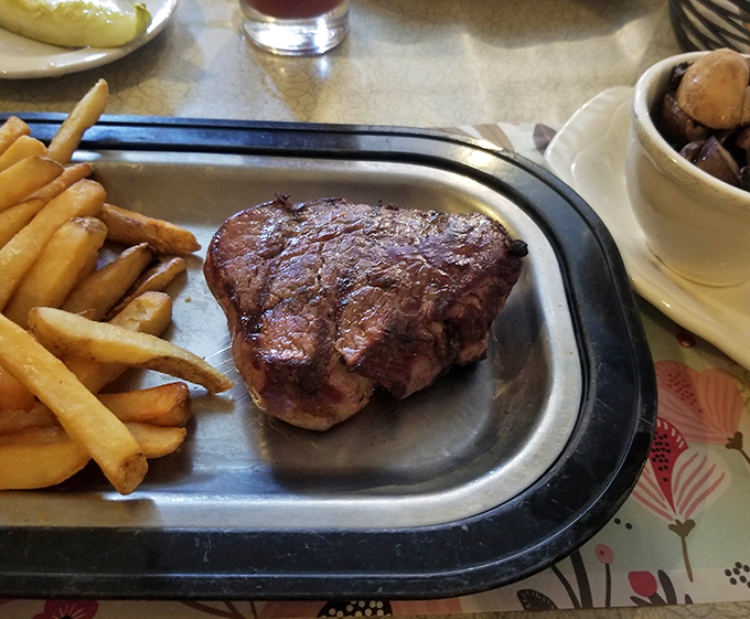 This filet doesn't just sit on the plate—it commands respect. Paired with classic fries, it's comfort food elevated to an art form.