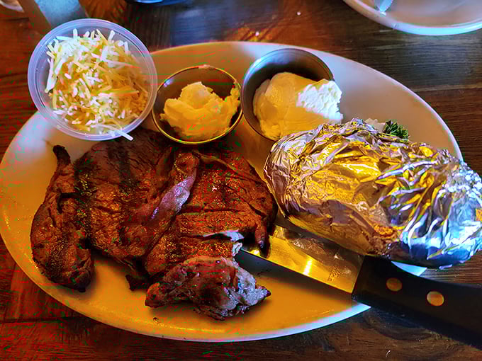 A plate that would make Fred Flintstone jealous—mesquite-grilled steak with all the trimmings and a baked potato ready for its close-up.