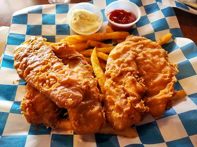 Golden-battered fish so crispy you can hear it from three tables away, with fries that deserve their own fan club.