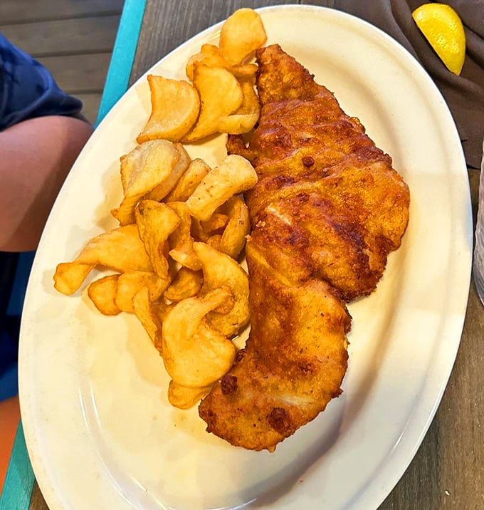Fish and chips that would make any British pub jealous, served with the kind of generous portions that define American hospitality.