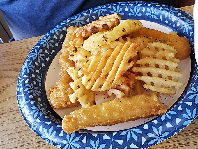 Fish and chips that would make a British pub nervous. Those waffle fries aren't just a side—they're the supporting actors who deserve their own Oscar.