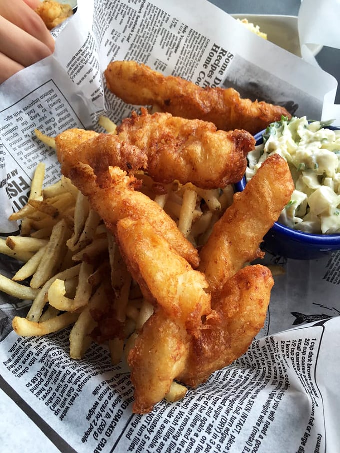 Golden-battered fish stands at attention alongside crispy fries and creamy slaw – the holy trinity of comfort food that transcends geographical boundaries.