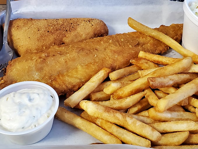 Golden-battered fish that would make the British proud, paired with fries that somehow maintain their crispness despite the journey from kitchen to table. 