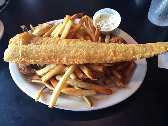 Fish so perfectly golden it belongs in Fort Knox, not just on this plate. Those hand-cut fries aren't playing supporting role—they're co-stars.