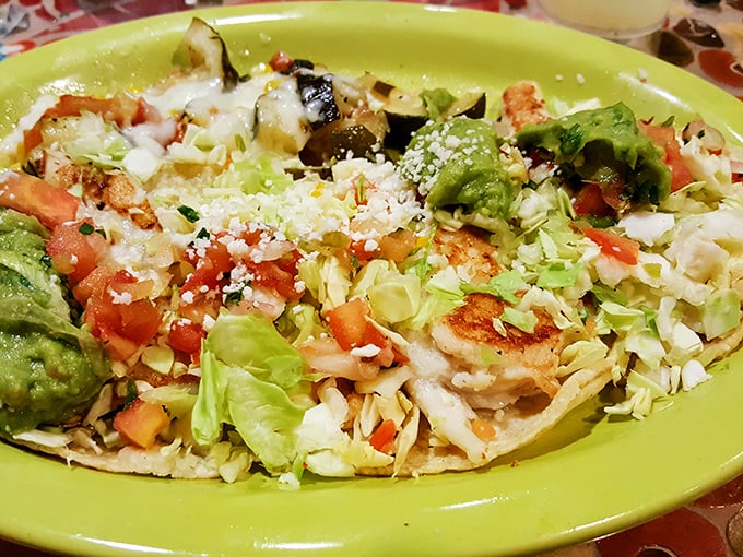 Fresh ingredients arranged with artistic precision. This isn't just a tostada—it's edible architecture where each component plays a crucial supporting role.