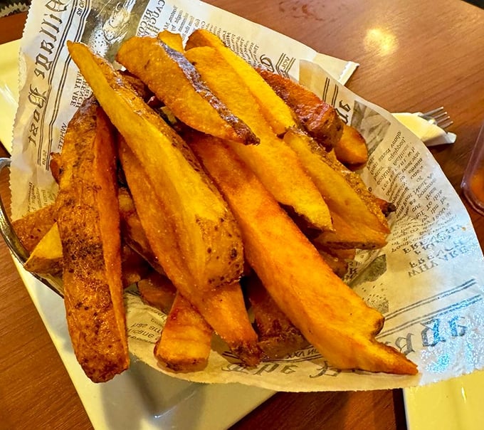 French fries served on newspaper – a crispy, golden tribute to simpler times when calories didn't count during vacation.