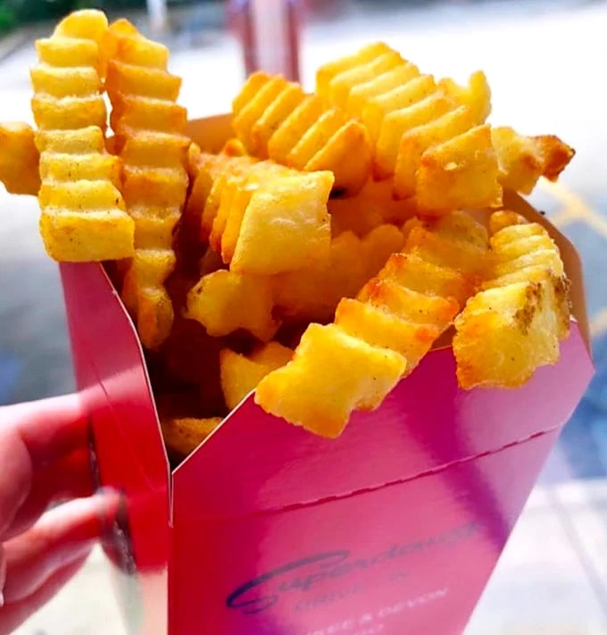 Crinkle-cut fries that actually taste like potatoes—what a concept! These golden beauties have the perfect crisp-to-fluffy ratio that fast food chains can only dream about. 