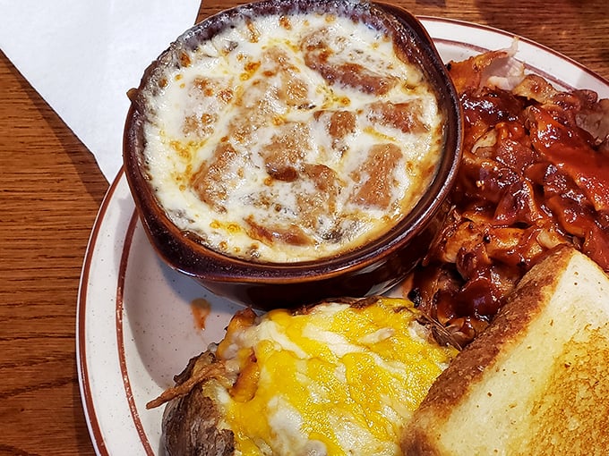 That's not just French onion soup—it's a bubbling cauldron of cheese-capped comfort that would make Julia Child weep with joy.