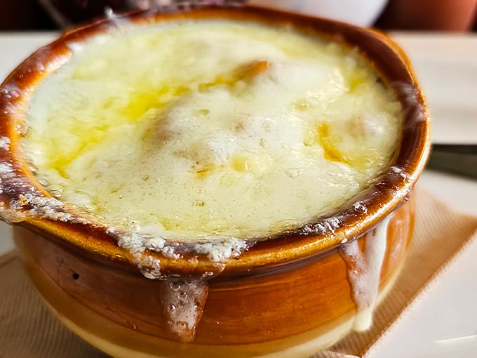 French onion soup that doesn't just warm your stomach but hugs your soul—that cheese pull should qualify as performance art.
