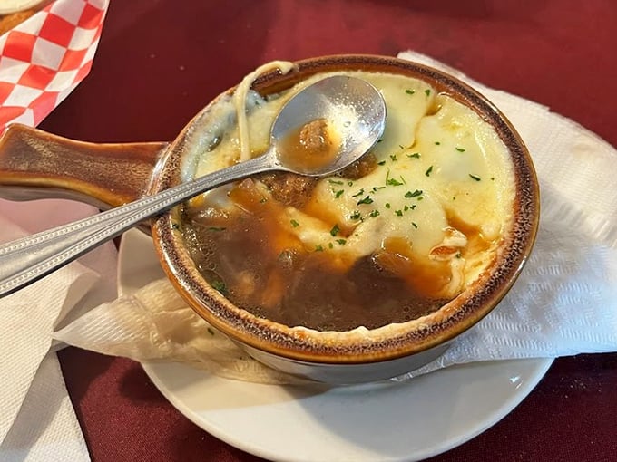 French onion soup that doesn't just warm your stomach but your soul—a cheese-topped sanctuary in a ceramic crock that deserves its own theme music.