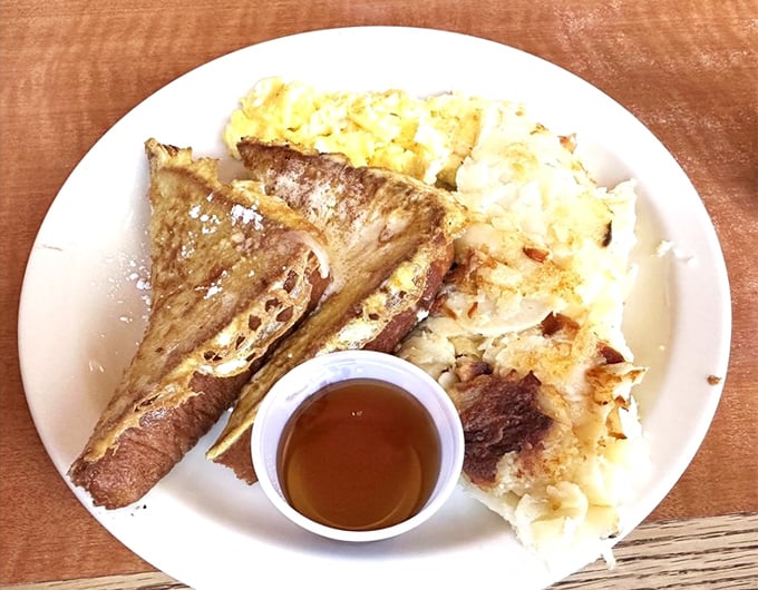 French toast that doesn't need fancy brioche or exotic toppings to impress—just perfect execution, maple syrup, and the promise of a nap afterward.