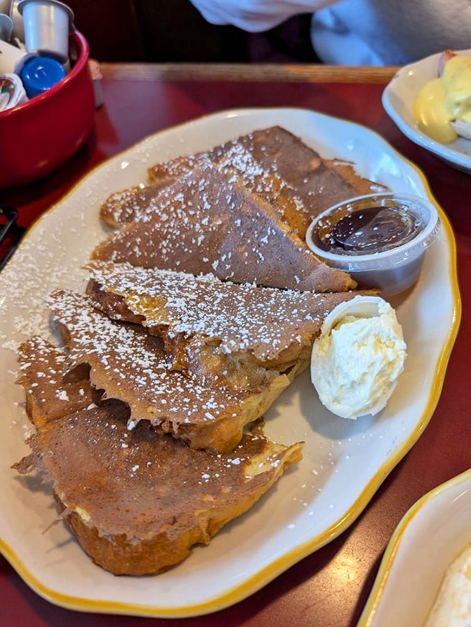 French toast dusted with powdered sugar – the kind that makes you wonder why anyone bothers with fancy brunch reservations elsewhere.