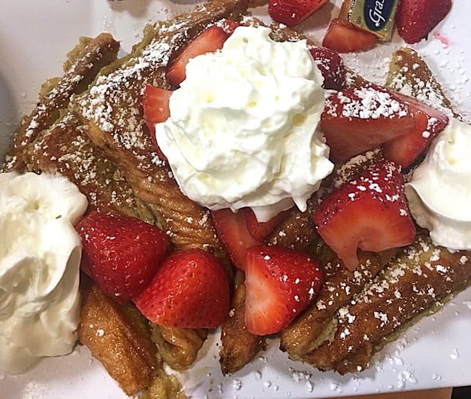 Strawberry French toast that makes you question why people eat anything else for breakfast. Whipped cream crowns this morning royalty.
