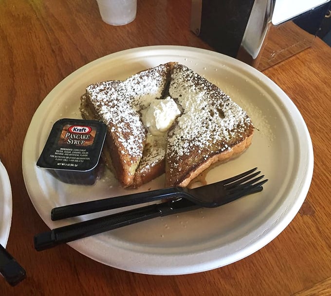 French toast that makes you question why anyone would ever eat cereal again. Dusted with powdered sugar and served with maple syrup—breakfast royalty.