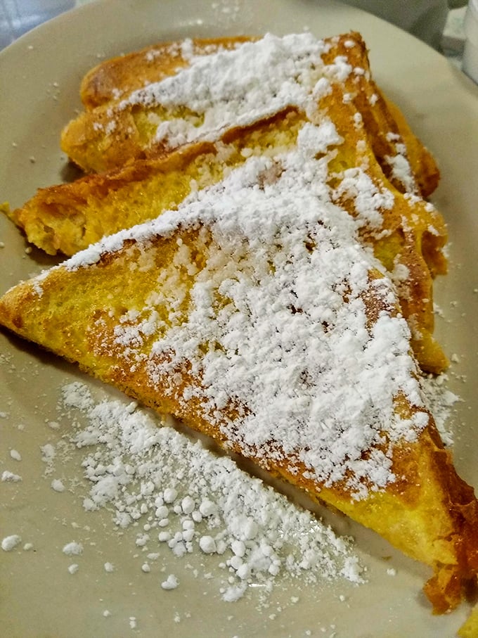 French toast dusted with powdered sugar snow – breakfast that straddles the line between meal and dessert with delicious ambiguity.