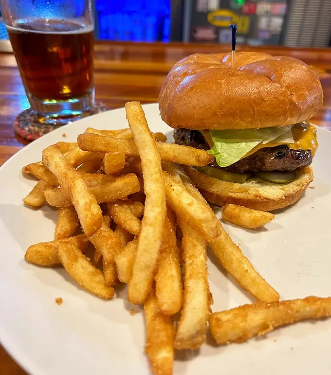 The classic combo that never disappoints: a perfectly charred burger with a mountain of crispy fries—comfort food that speaks a universal language.