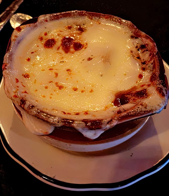 French onion soup that's wearing a cheese blanket. Comfort food that hugs you from the inside out.
