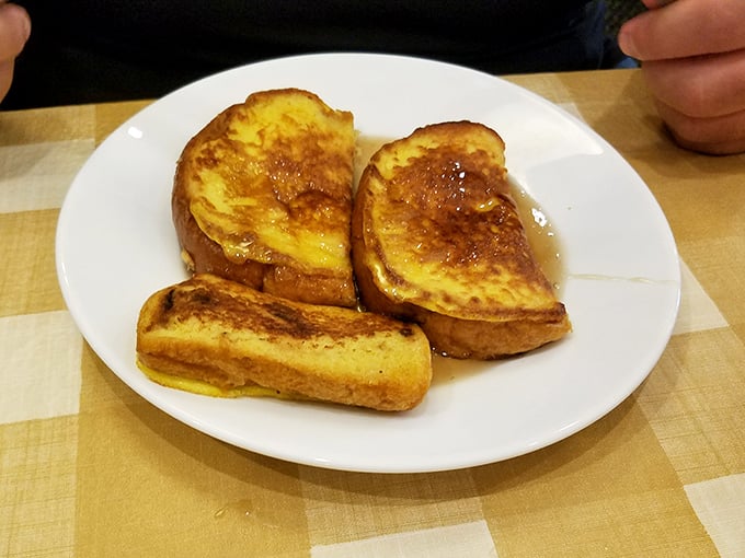 French toast that looks like it bathed in custard before hitting the griddle—breakfast that doubles as dessert without a hint of remorse.