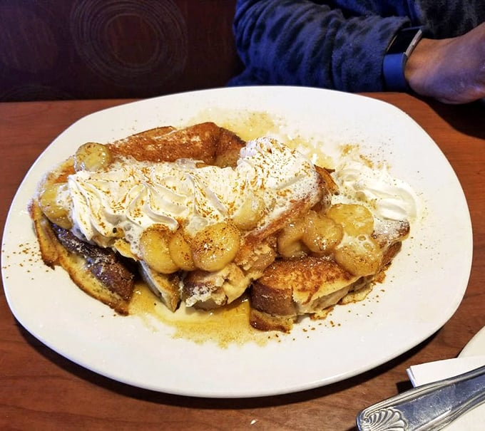 French toast that's dressed up fancier than most people at Sunday brunch. Those caramelized bananas aren't just toppings—they're jewelry.