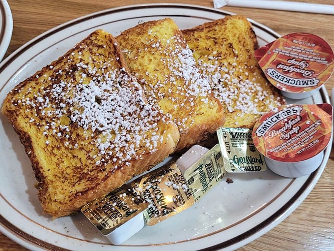 Golden French toast dusted with powdered sugar like fresh snow on a Pennsylvania morning – breakfast poetry on a plate.